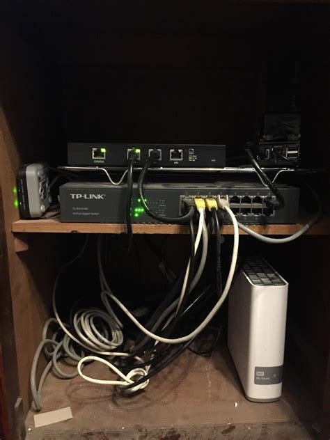 added a pi hole today networking cupboard needs some work though