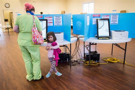 Georgia Voters Flock To Polling Sites For Crucial Runoff Races