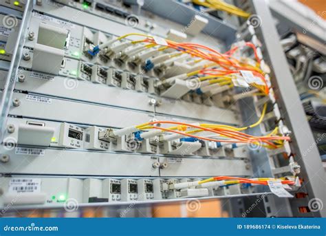 Server Rack With Red Internet Patch Cord Cables Connected To Patch Panel In Server Room Stock
