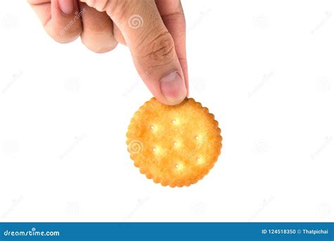 Male Hand Holding Round Cracker Cookie Isolated On White Background