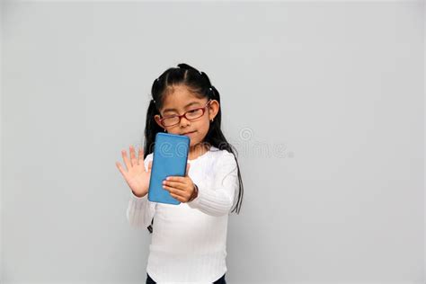 4 Year Old Latin Girl Uses Her Cell Phone To Make Video Calls Play