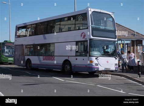 First Wessex Scania Bus Loading Passengers In Weymouth A Sea Side