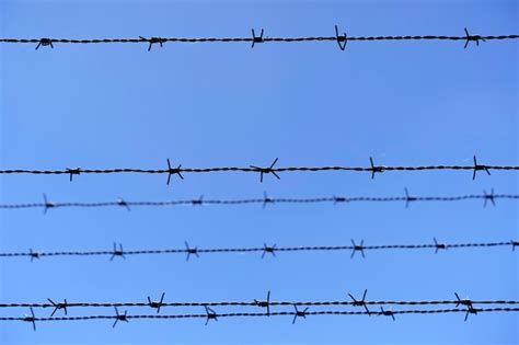 Premium Photo Fence With Barbed Wire Border Prohibition Zone