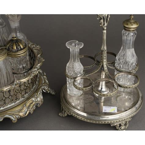 A Victorian Silver Plate Cruet Stand With Central Ring Handle With Eleven Wire Work Apertures For C