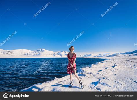 Girl Slender Beautiful Blonde In A Red Dress In The Frost On A Background Of Mountains Svalbard