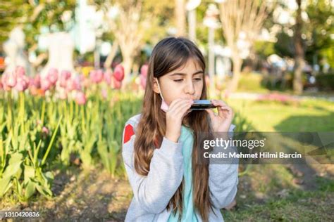 Female Playing Harmonica Photos And Premium High Res Pictures Getty