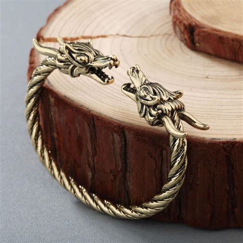Armband Torc Gehoornde Draak Goud De Druidenwinkel
