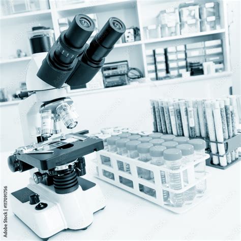 Science Microscope On Lab Bench Microbiology Laboratory Blue Toned