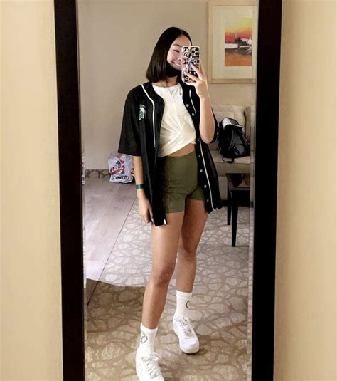 A Woman Taking A Selfie In A Mirror