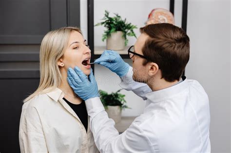 Doctor Using Inspection Spatula To Examine Patient Throat Ent Doctor
