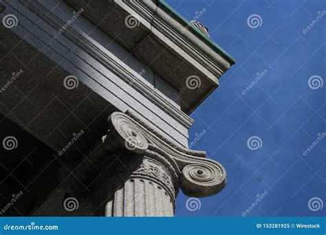 Neoclassical Lonic Style Column With Blue Sky In The Background Stock