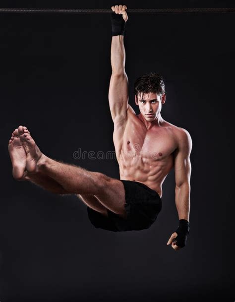 Hes A Lean Mean Training Machine A Focussed Young Man Working Out