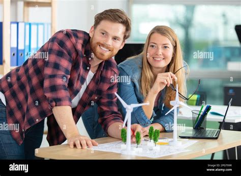 Portrait Of Male Female Architects Discussing Plans Stock Photo Alamy