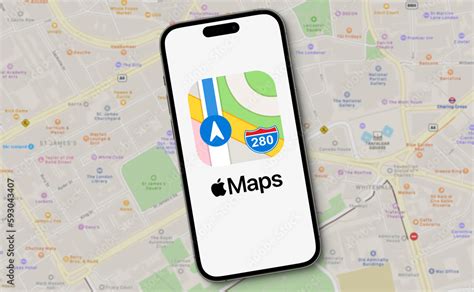 Apple Maps Logo With Lettering Is Displayed On A Smartphone Lying On A