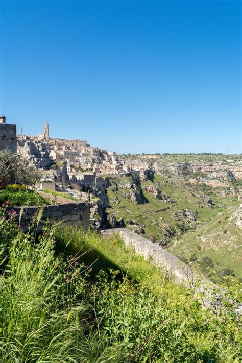 Vertical View Of The Sassi Of Matera On Blue Sky Background Mat Stock