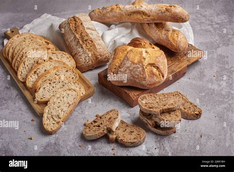 A Different Types Of Bread With Cut Pieces On Marble Surface Stock Photo Alamy