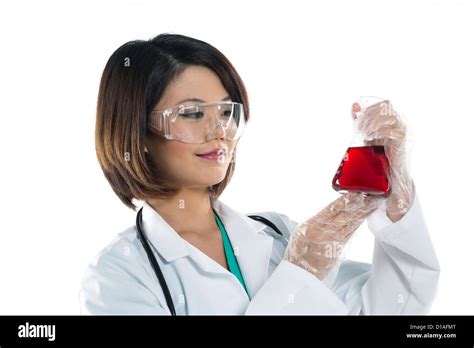 An Chinese Scientific Researcher Holding At A Liquid Solution In A Lab