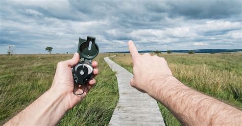 Premium Photo Pov Image Of Traveler Man Holding A Compass And