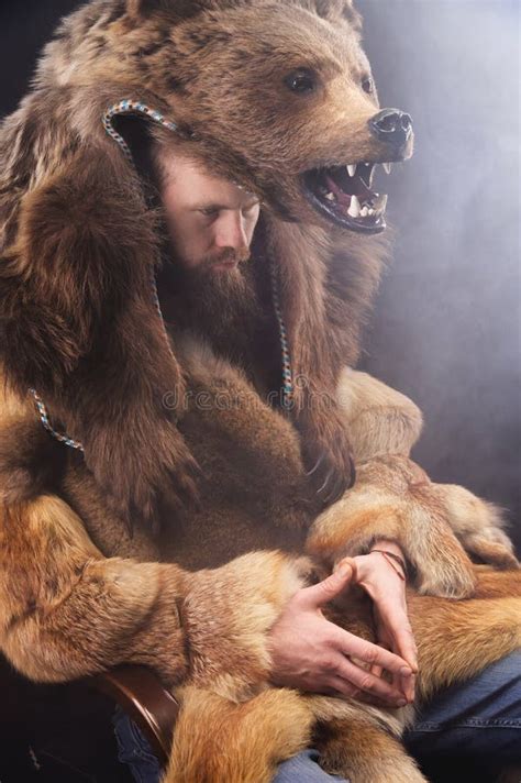 Man With A Bearand X27s Head Clothes Made From The Skin Of An Animal