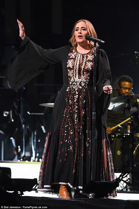 Adele Poses Underneath Tottenham Football Scarf While Backstage In