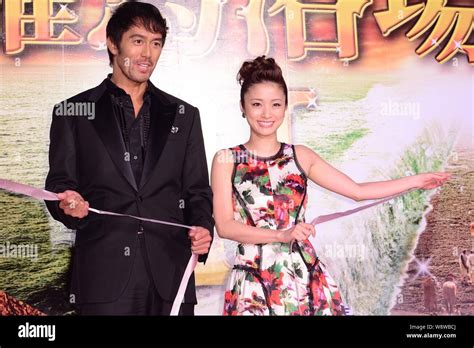 Japanese Actor Hiroshi Abe Left And Actress Aya Ueto Pose At A