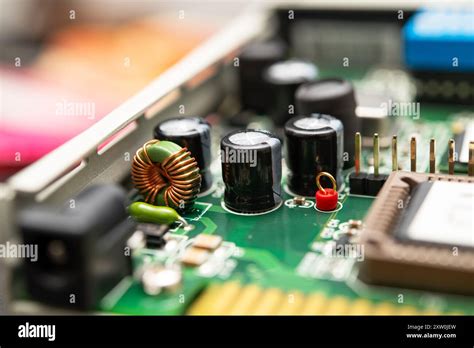 Detailed View Of A Modern Electronic Circuit Board Featuring Capacitors An Inductor And