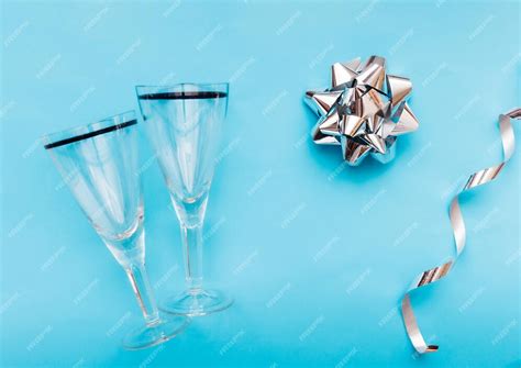 Premium Photo Quality Two Empty Clean Glasses For Drinks On A Clear Blue Background With A