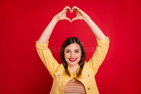 Photo Of Attractive Lady Good Mood Hold Arms Together Above Head Making