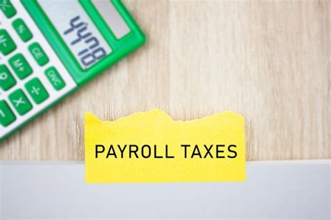 Premium Photo Payroll Taxes Inscription With Calculator Payroll Taxes
