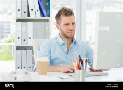 Handsome Man Working At His Desk Stock Photo Alamy