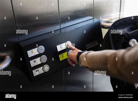 Woman S Hand Pushing Button Inside Lift Stock Photo Alamy