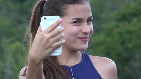Teen Girl Taking Selfy With Cell Phone — Stock Video © Dtiberio 132880816