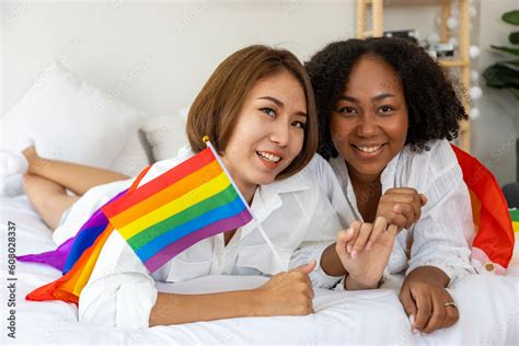 Couple Of Same Sex Marriage From Difference Races With Lgbtq Rainbow