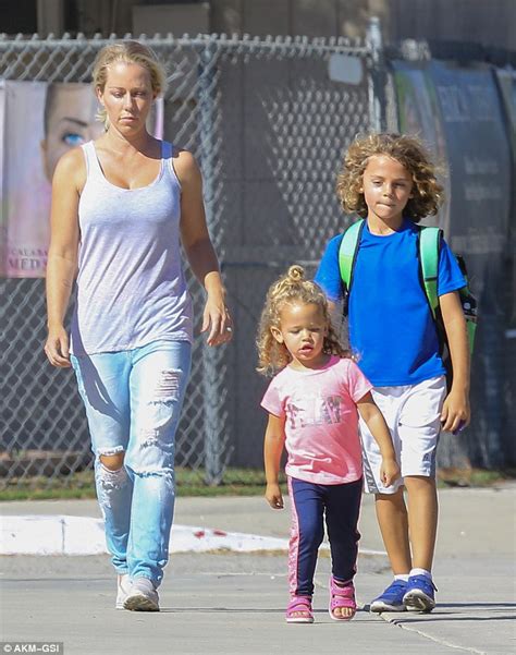 Kendra Wilkinson Dons Ripped Jeans And Loose Tank Top As She Attends