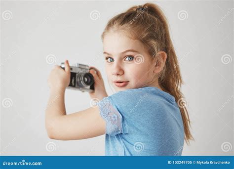 Close Up Portrait Of Cheerful Cute Girl With Blonde Hair And Blue Eyes