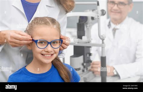 Front View Of Happy Girl Wearing New Glasses In Optical Store Pretty