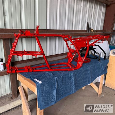 ATV Frame Coated with a Gloss White and Soft Red Candy Finish | Prismatic Powders