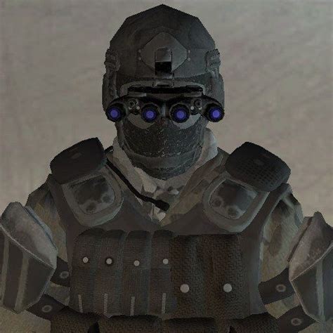 A Man In Armor With Blue Eyes Standing Next To A Wall