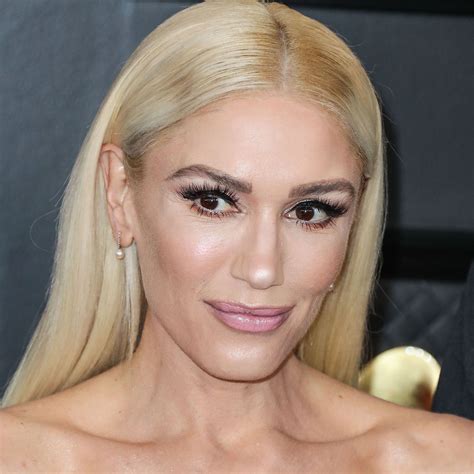 Gwen Stefani Poses In A Pink Bedazzled Flower Dress For A Beauty Collab