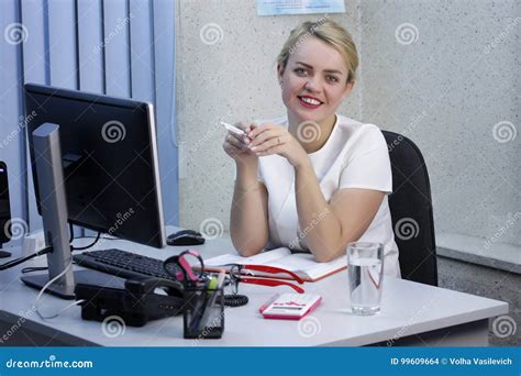 Young Beautiful Blonde Girl Is Working In The Office Close Up Stock