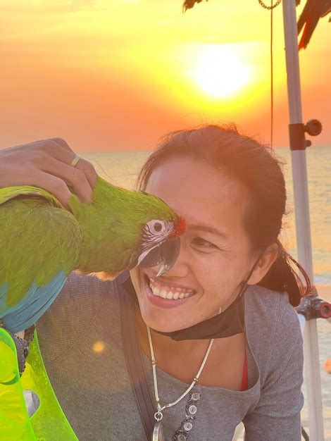 Premium Photo Close Up Of Thai Woman With Buffon Macaw