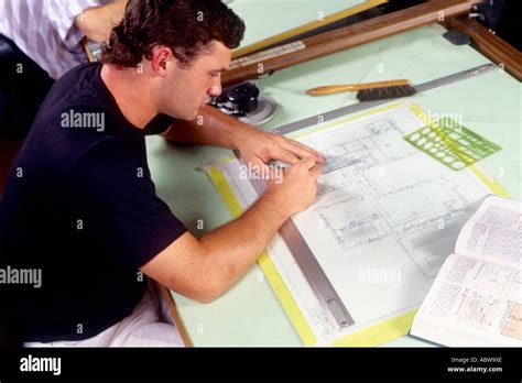 High School 11th Grade Drafting Class With Draft Tables Working In