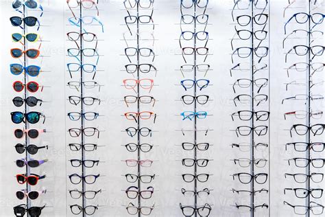 Sunglasses And Glasses In The Shop Display Shelves Stand With Glasses