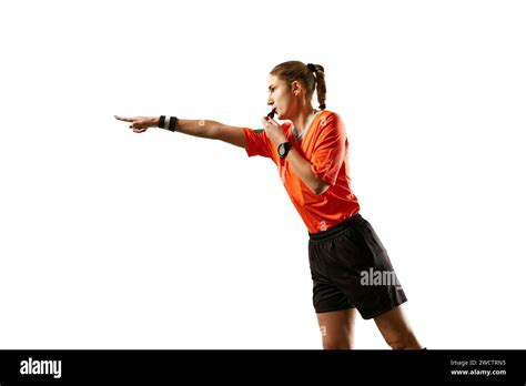 Young Woman Football Referee In Uniform Pointing And Blowing Whistle