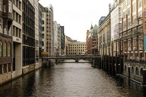 Premium Photo A Bridge Over A Canal With A Bridge In The Background