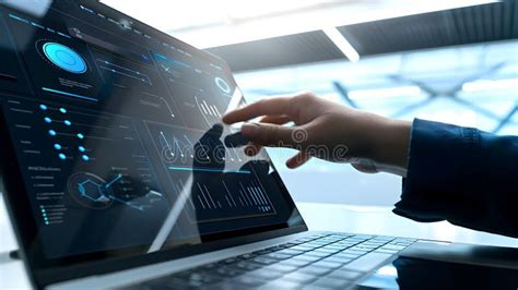 person using a touchscreen laptop displaying data analytics and graphs