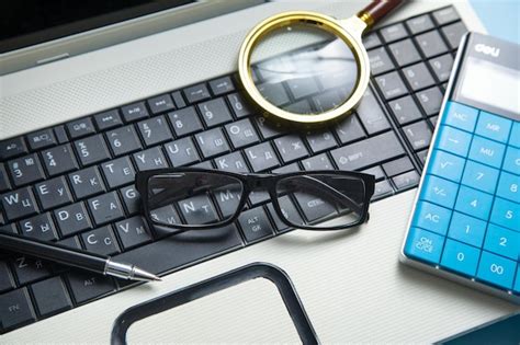 Premium Photo Black Eyeglasses With A Computer Keyboard