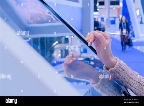 Woman Using Interactive Touchscreen Display At Technology Exhibition Stock Photo Alamy