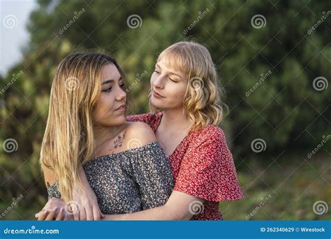Young Lesbian Couple Cuddling Each Other In Nature Stock Image Image