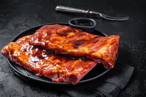 Ready For Bbq Raw Pork Spare Ribs With Barbecue Sauce Black Background